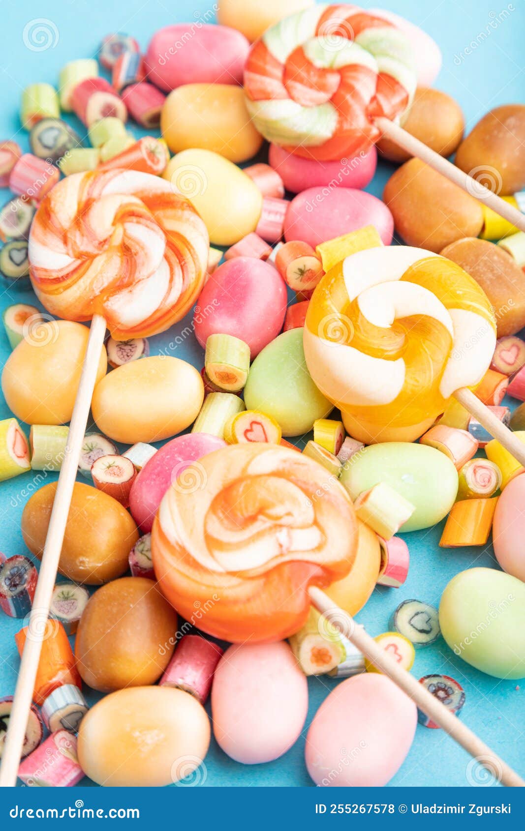 Various Caramel Candies on Blue Background. Side View Stock Photo ...