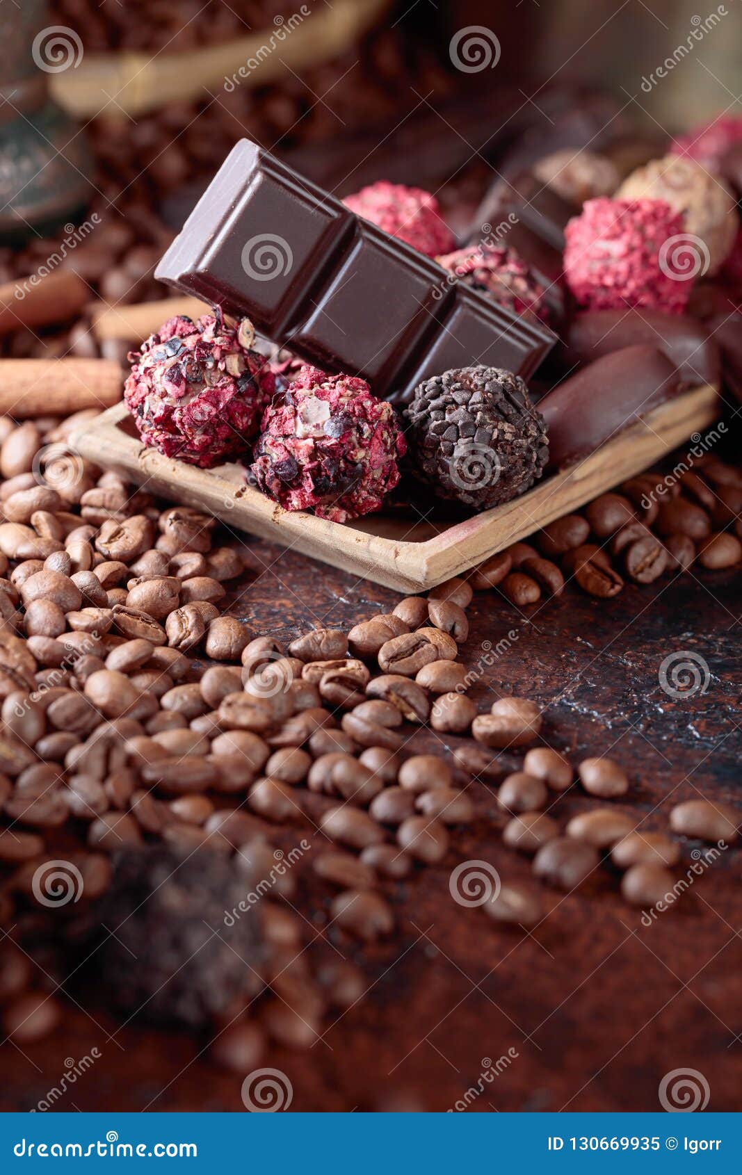 Various Chocolates in Wooden Dish on a Brown Table. Stock Image - Image ...