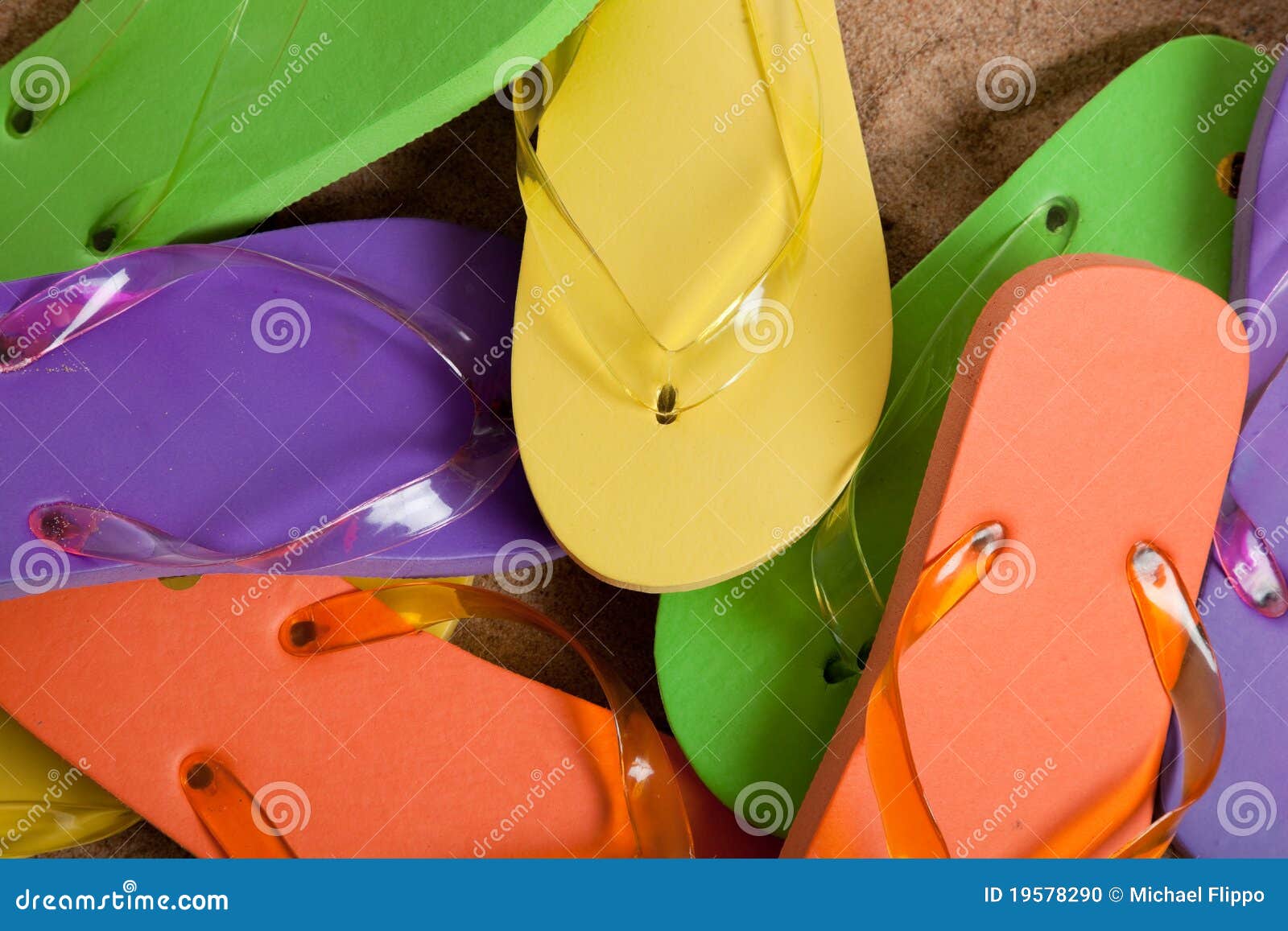Various Colored Flipflops on Sand Stock Photo - Image of flipflop ...