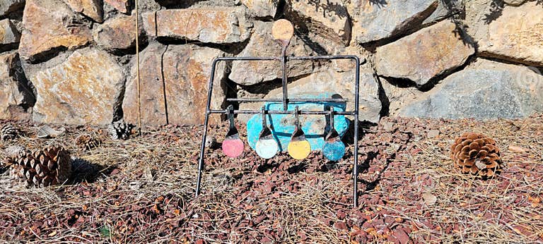 Several Colored Objects Laying on the Ground in Front of a Wall Stock ...