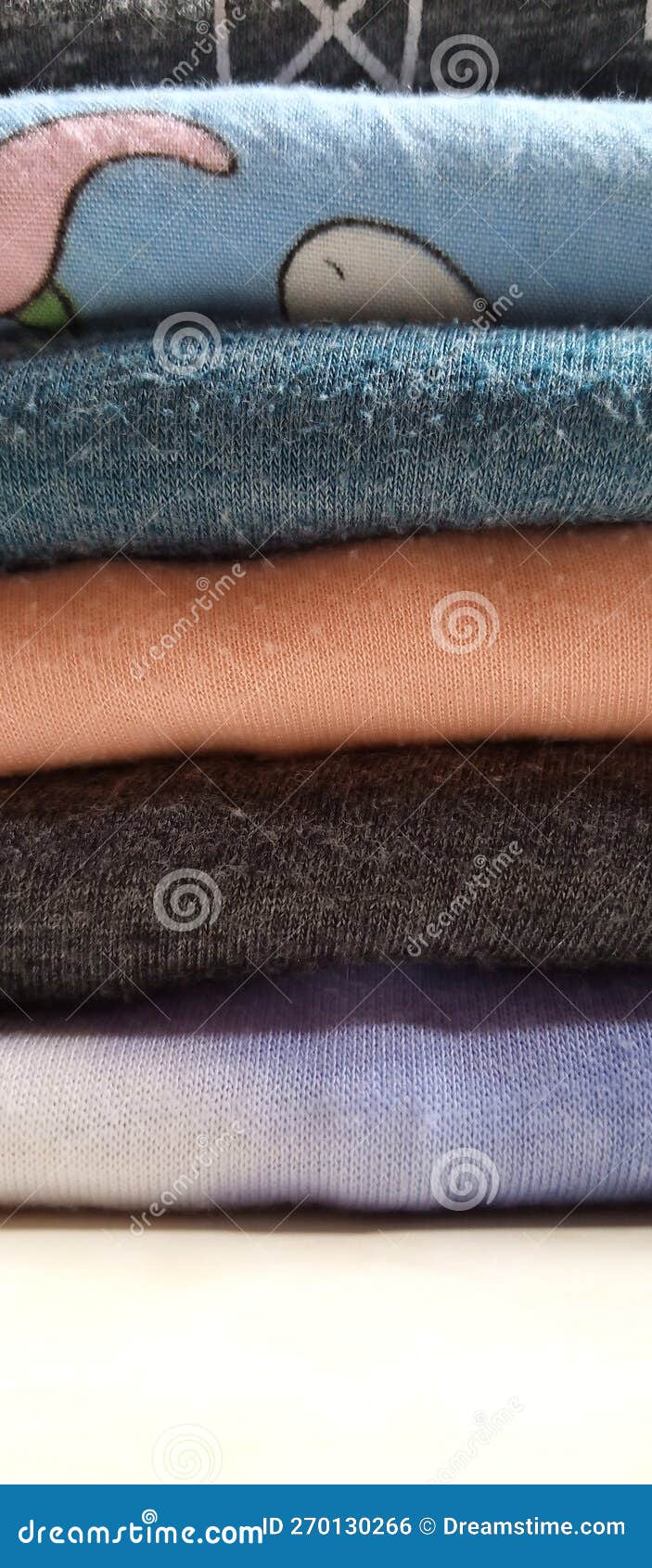 Various Colors of Piles of Clothes on the White Floor? Stock Photo ...