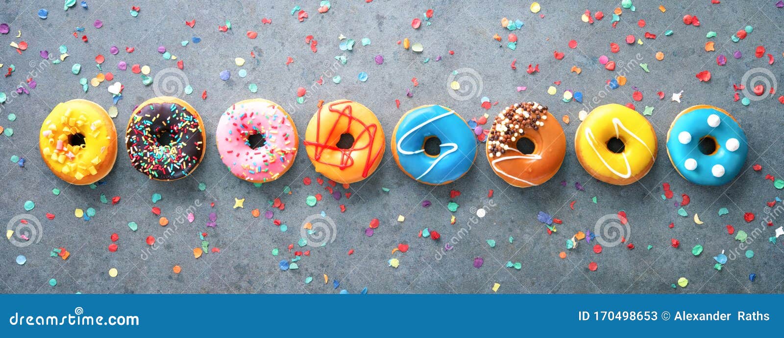 Various Colourful Donuts in a Row with Confetti Stock Image - Image of ...