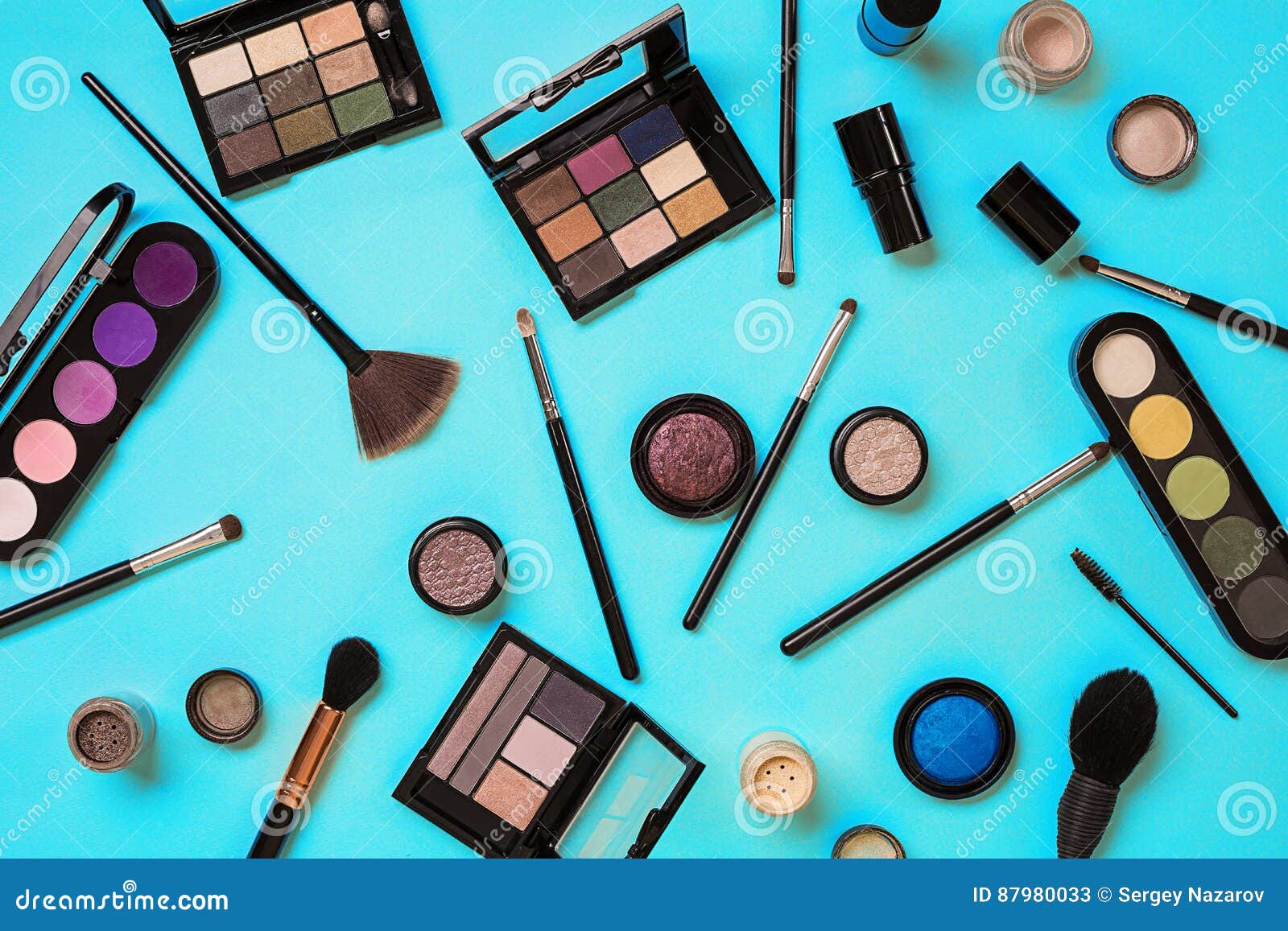 Various Cosmetics and Brushes on Blue Background Stock Image - Image of ...