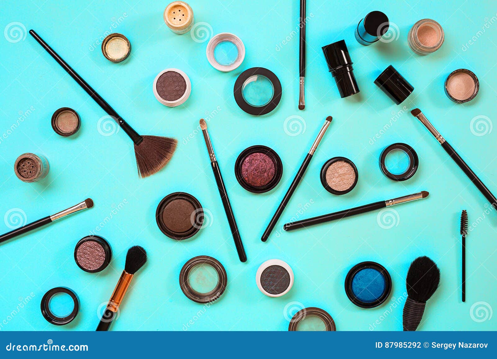 Various Cosmetics and Brushes on Blue Background Stock Photo - Image of ...