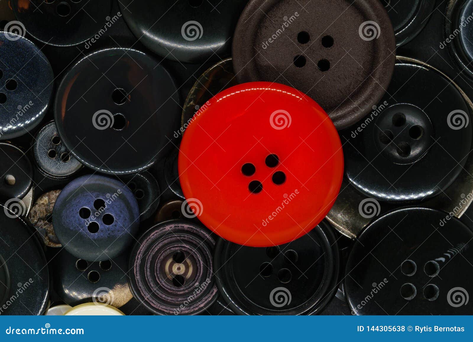 Various Dark Clothes Buttons Background with One Red Button Stock Photo ...