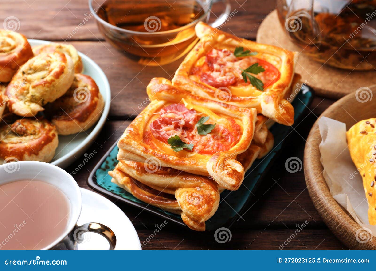 Various Delicious Puff Pastry Served with Tea on Wooden Table Stock ...