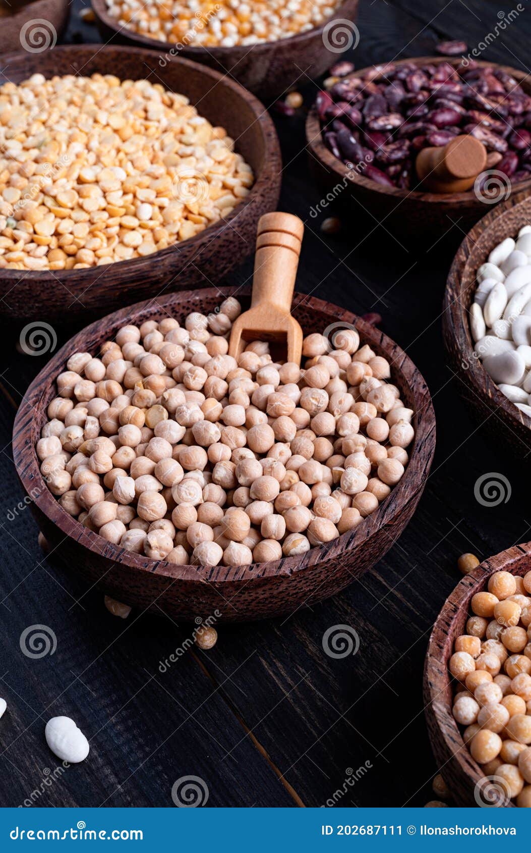 Various Dried Legumes in Wooden Bowls on Wooden Background Stock Image ...