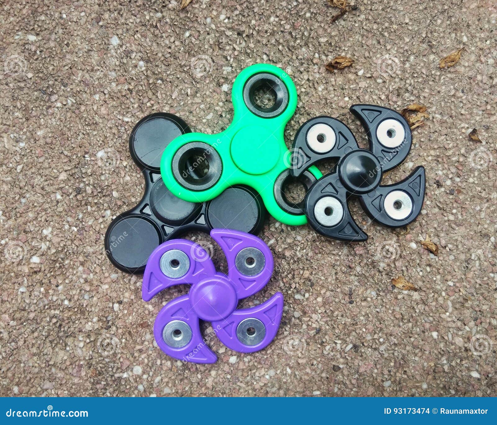 Various Fidget Spinner Over the Sand Stock Photo - Image of color ...