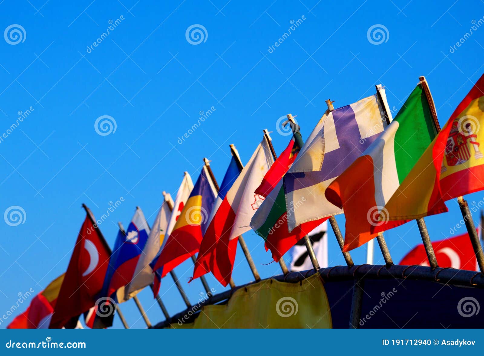 Various Flags in a Row Against Blue Sky Stock Photo - Image of blue ...