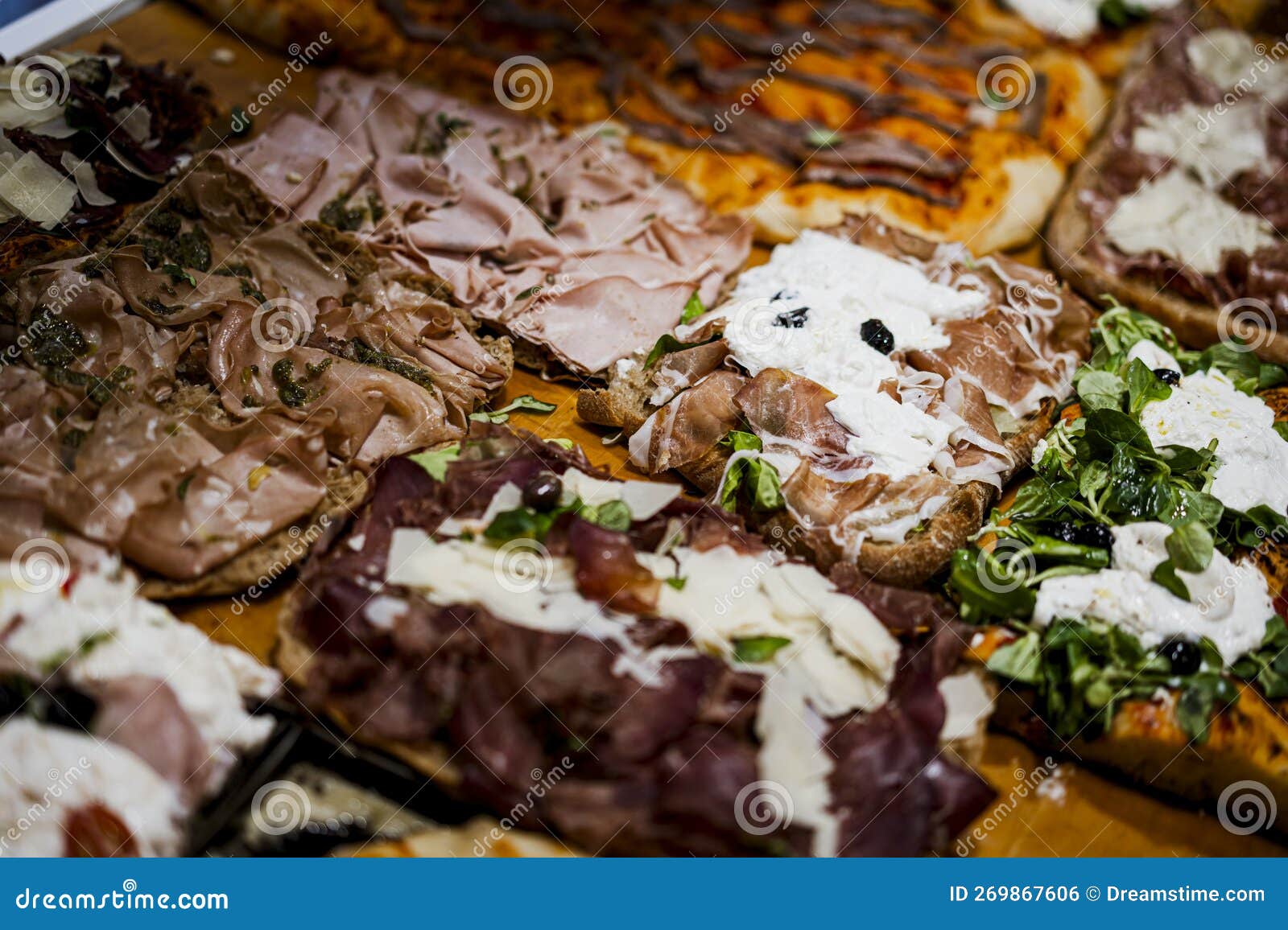 Various Flavors Pizza Cut into Square Slices Stock Photo - Image of ...