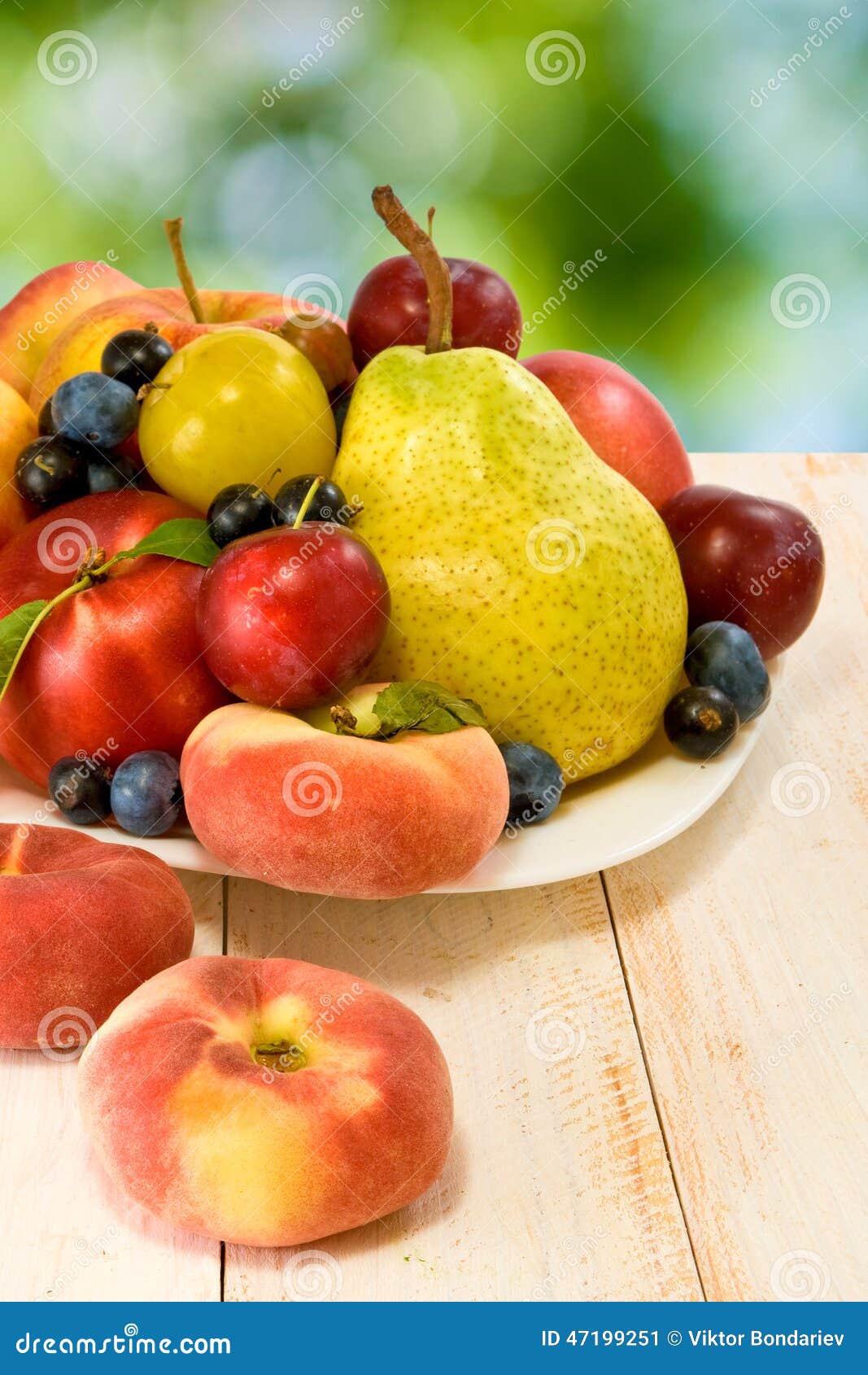 Various Fruits on a Table on Green Background Stock Image - Image of ...