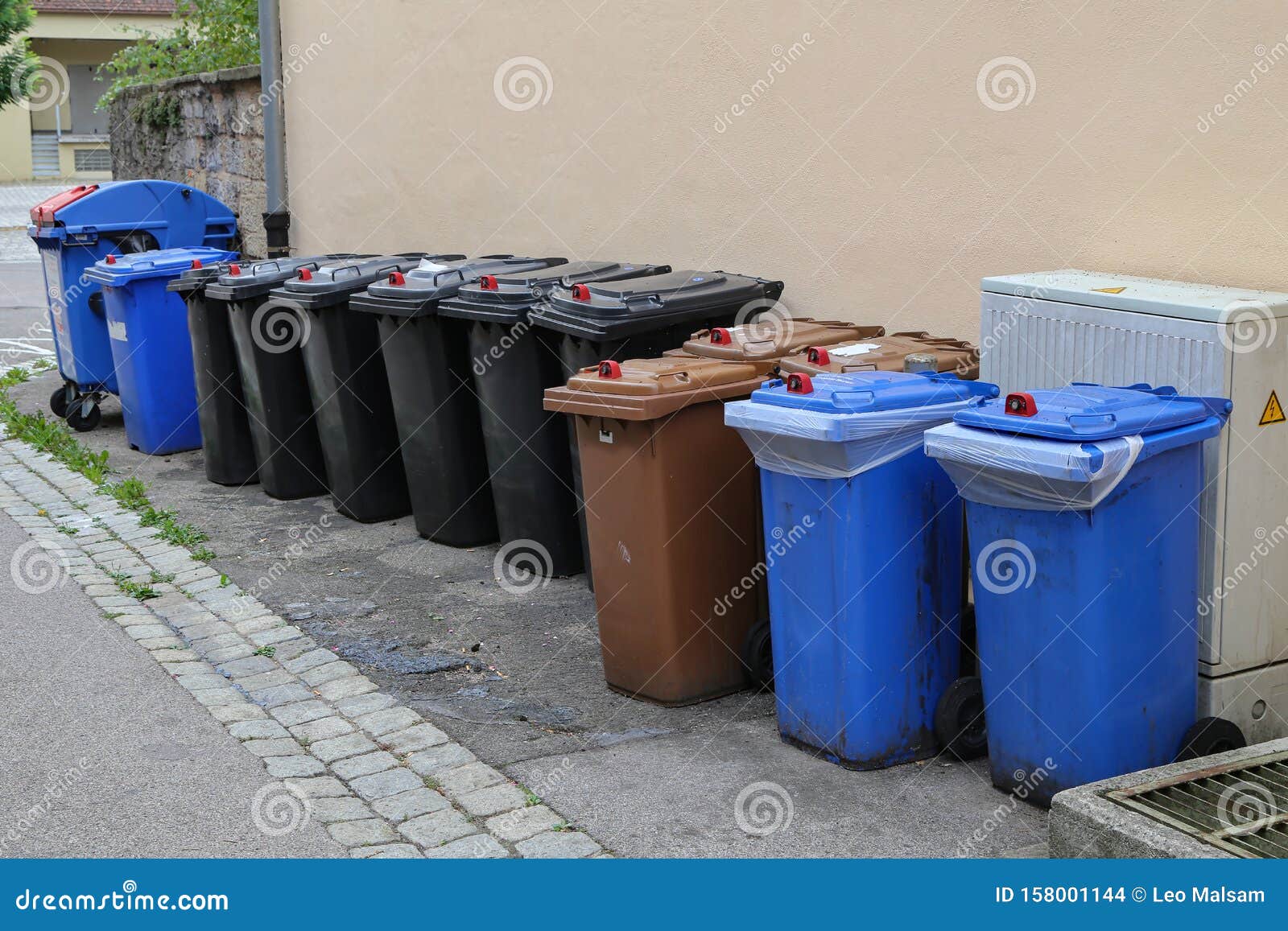 Various Garbage Cans Stand on the Street Stock Photo - Image of black ...