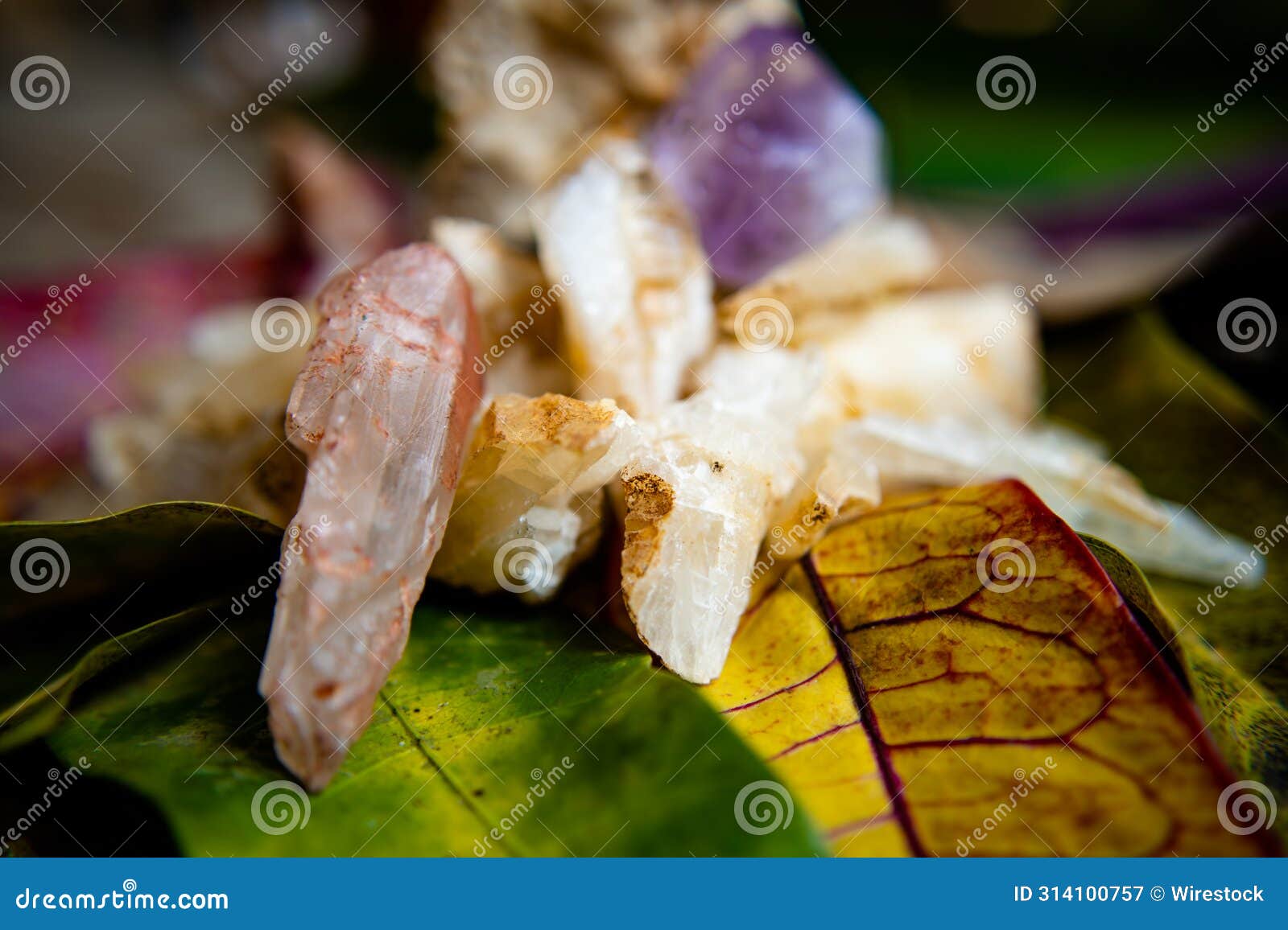Various Gemstones and Crystals Displayed on a Plate Atop a Table Stock ...