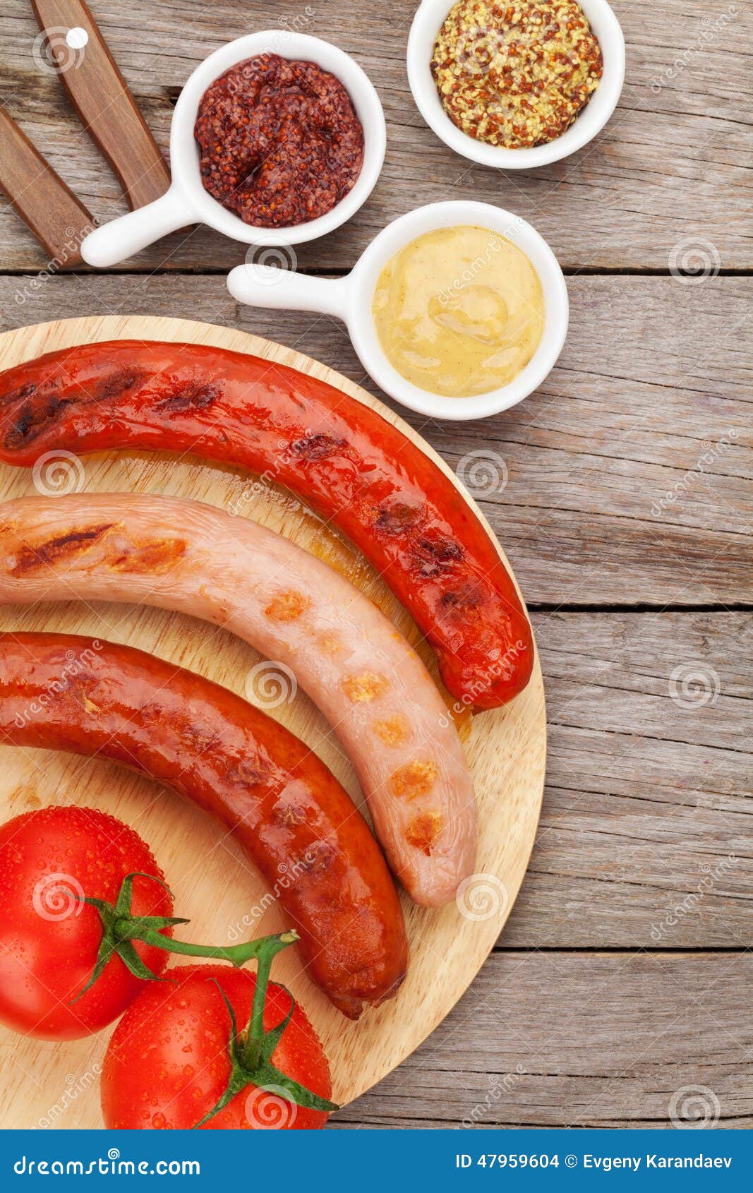 Various Grilled Sausages with Condiments and Tomatoes Stock Photo ...