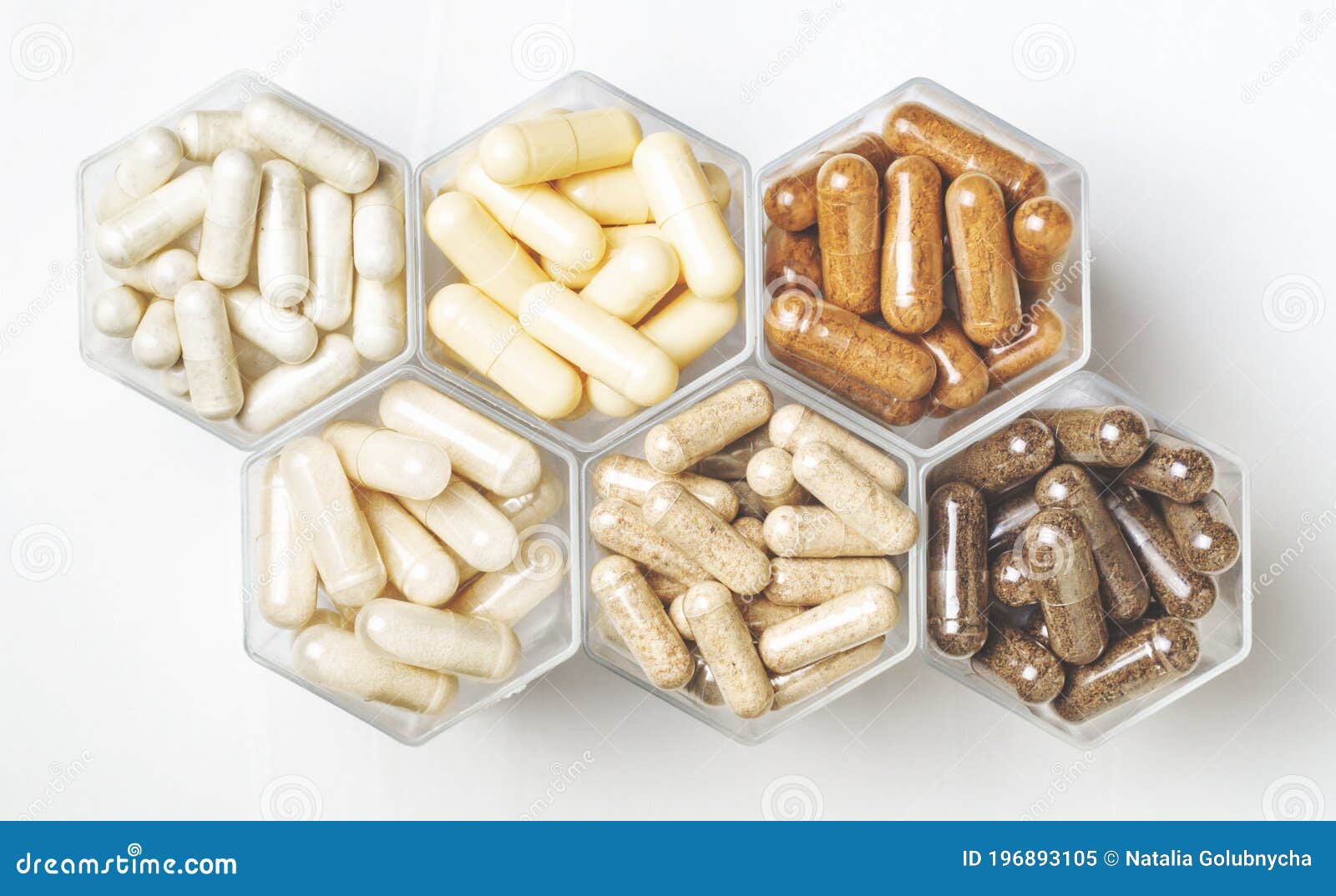 Various Herbal and Homeopathic Medical Capsules in Hexagonal Jars Stock ...