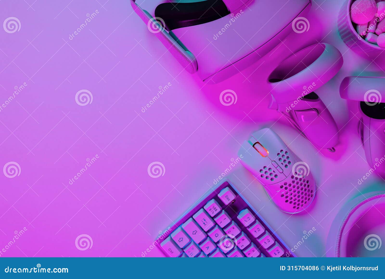 Various Modern Gaming Accessories on Pink Desk Stock Photo - Image of ...