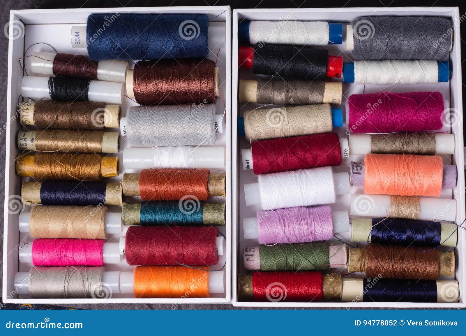 Various Multicolored Used Sewing Threads in a Box, Stacked in a Stock ...