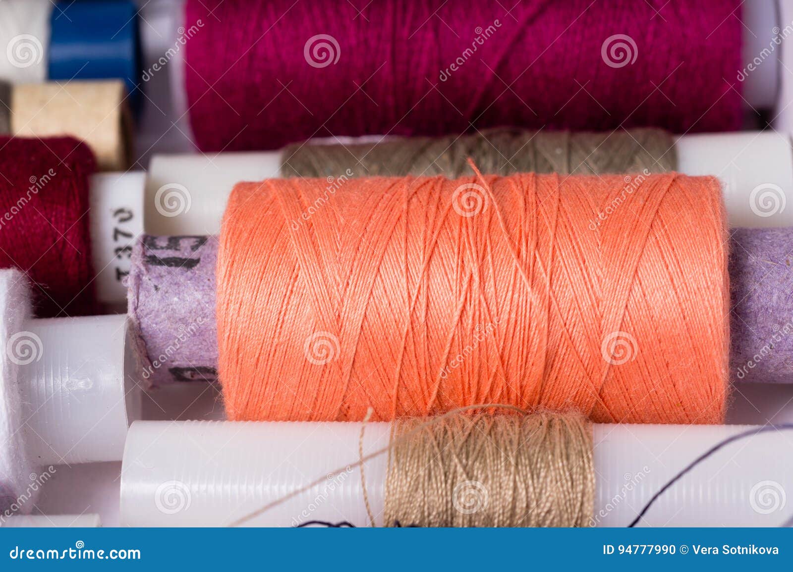 Various Multicolored Used Sewing Threads in a Box, Stacked in a Stock ...
