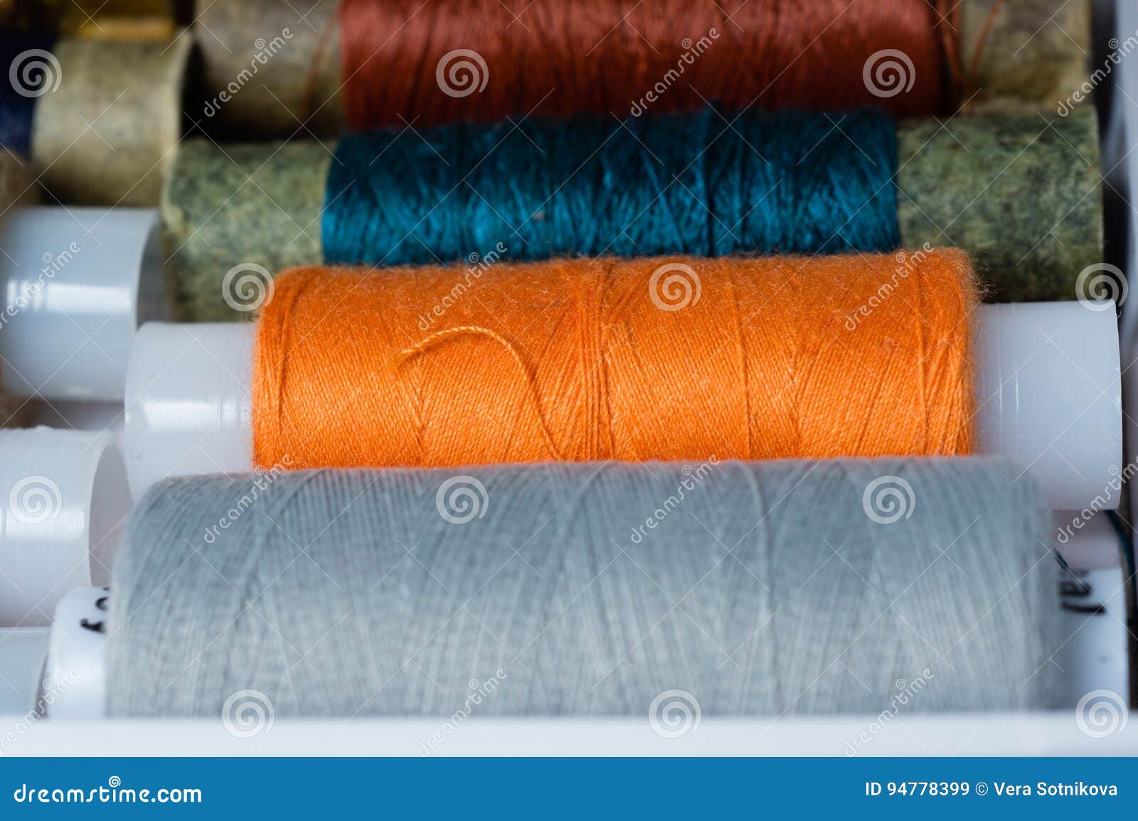 Various Multicolored Used Sewing Threads in a Box, Stacked in a Stock ...
