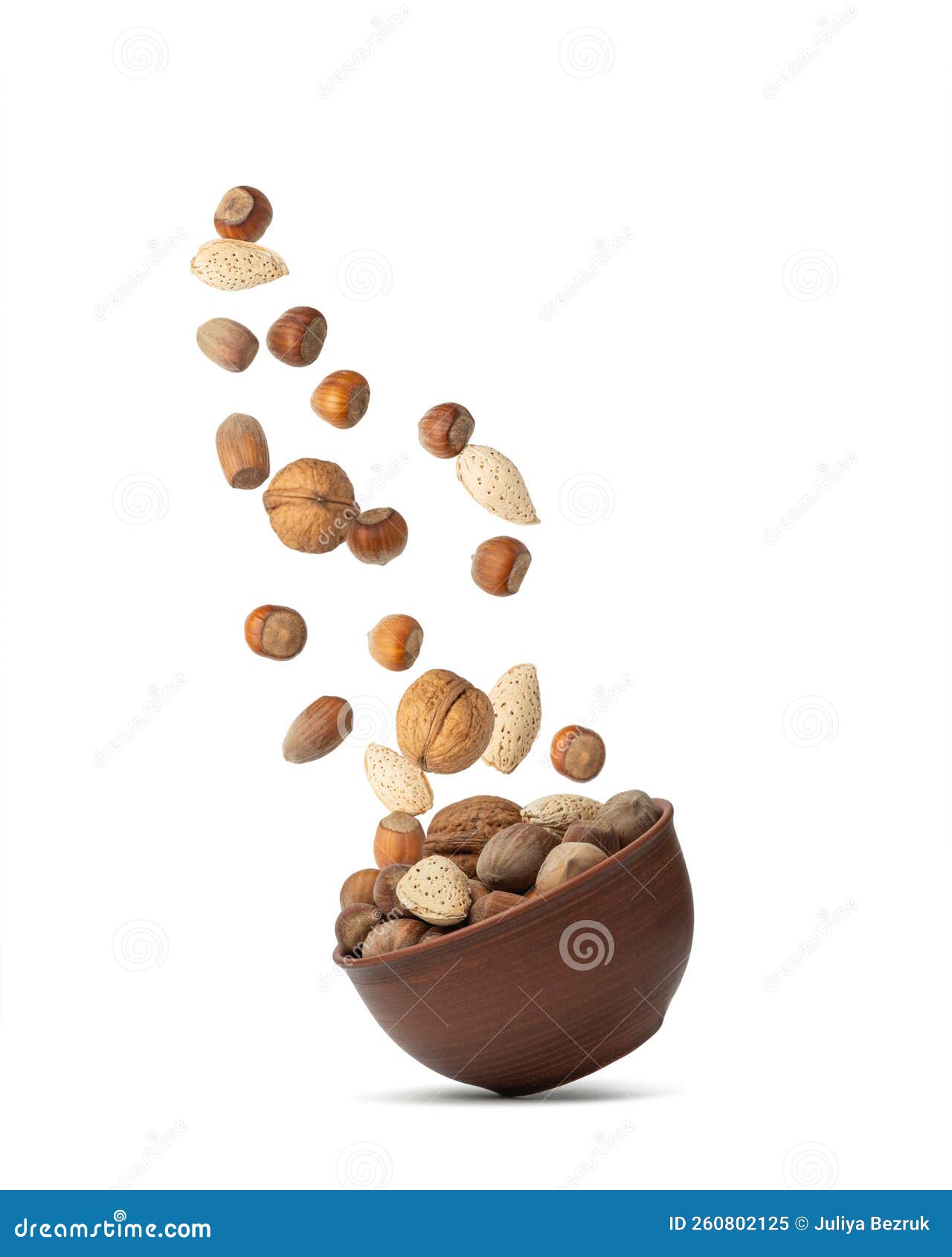 Various Nuts Falling into a Cup Isolated on White Stock Image - Image ...