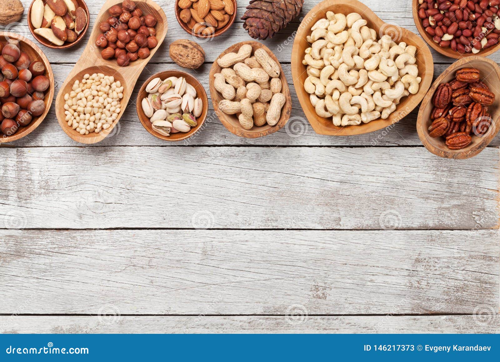 Various Nuts Selection on Wooden Table Stock Image - Image of peanuts ...