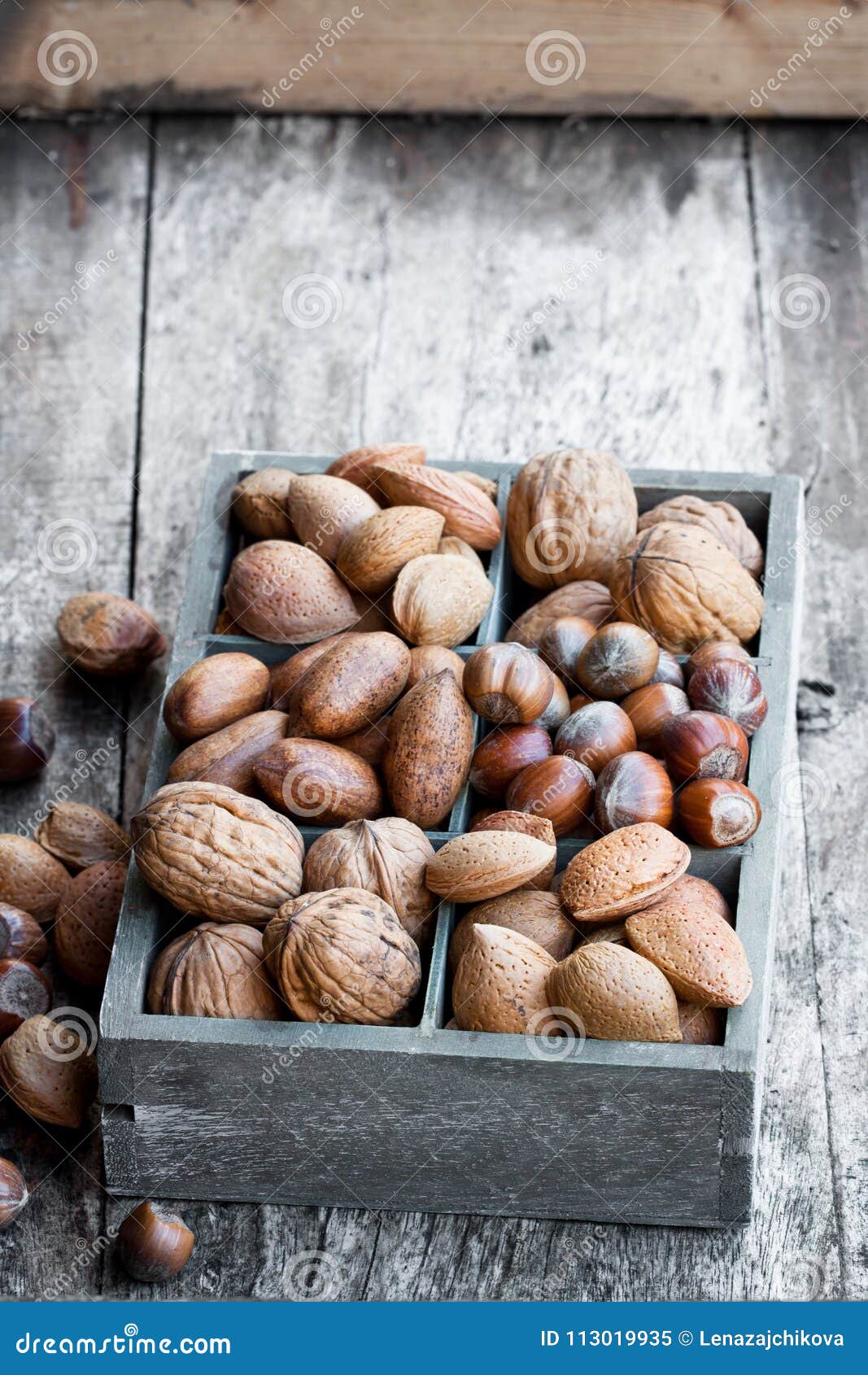 Various Nuts in Wooden Box on Rustic Table Stock Image - Image of ...