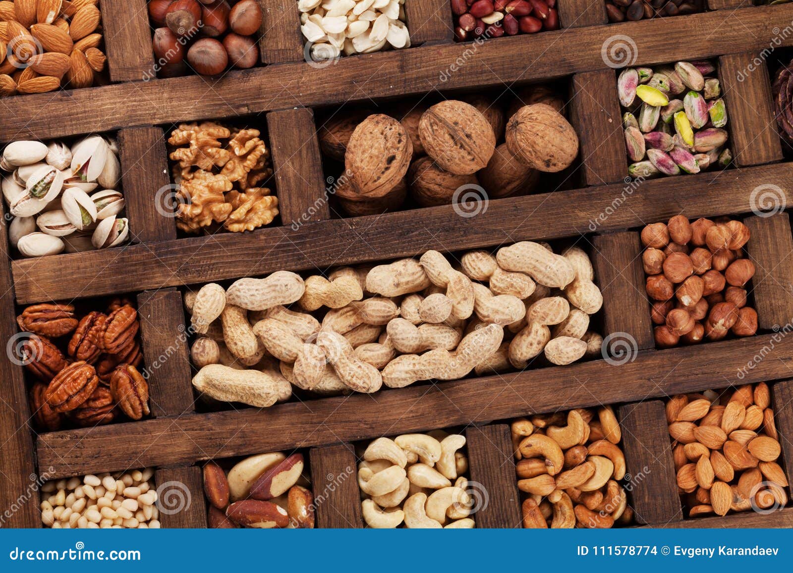 Various nuts in wooden box stock photo. Image of fruits - 111578774