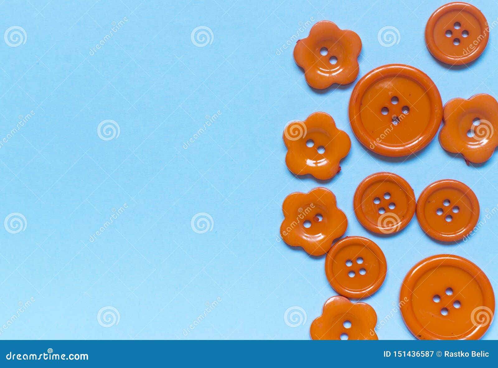 Various Orange Sewing Buttons on Blue Background Stock Image - Image of ...