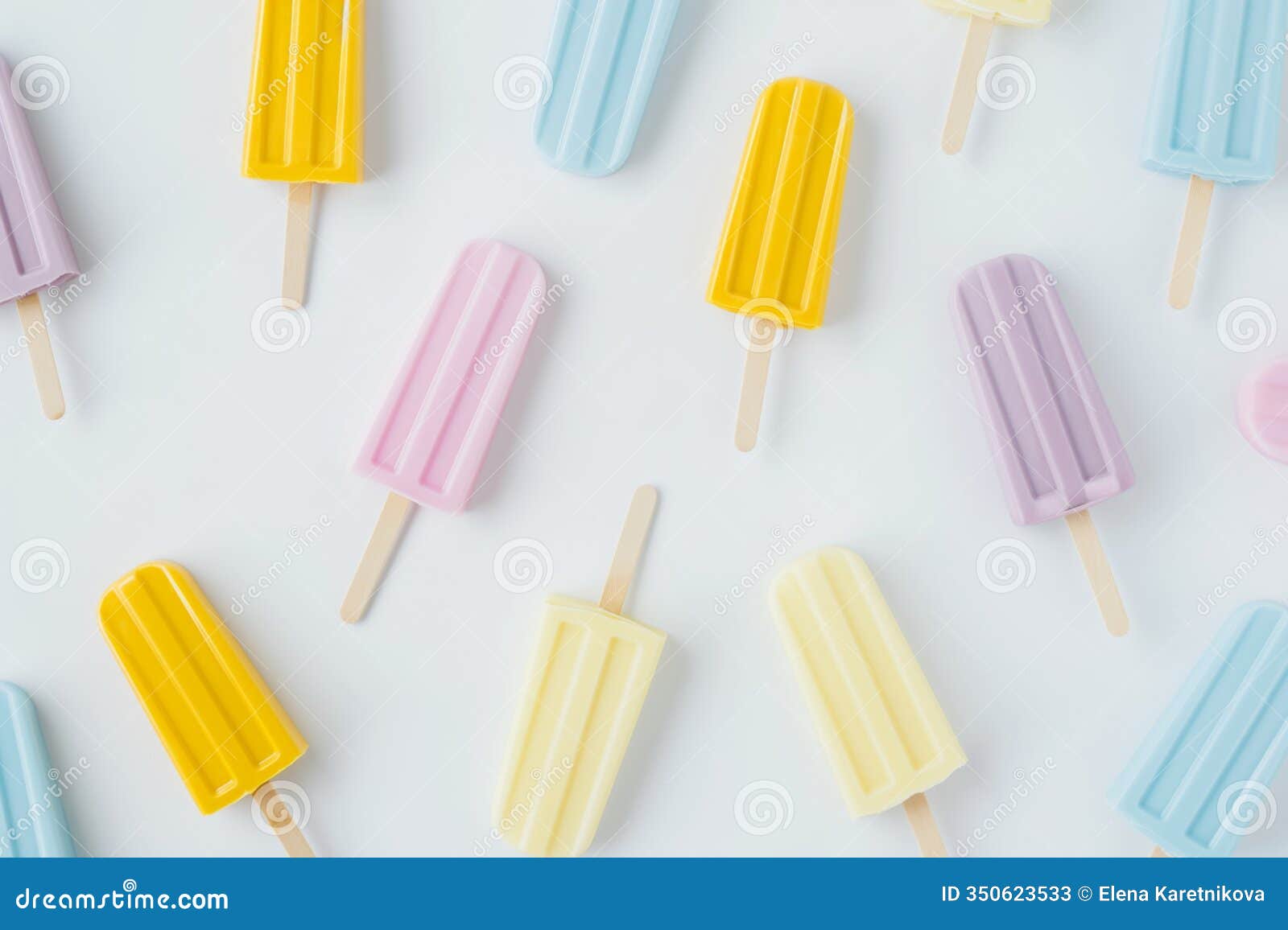 Various Pastel-colored Popsicles are Organized in Rows on a White ...