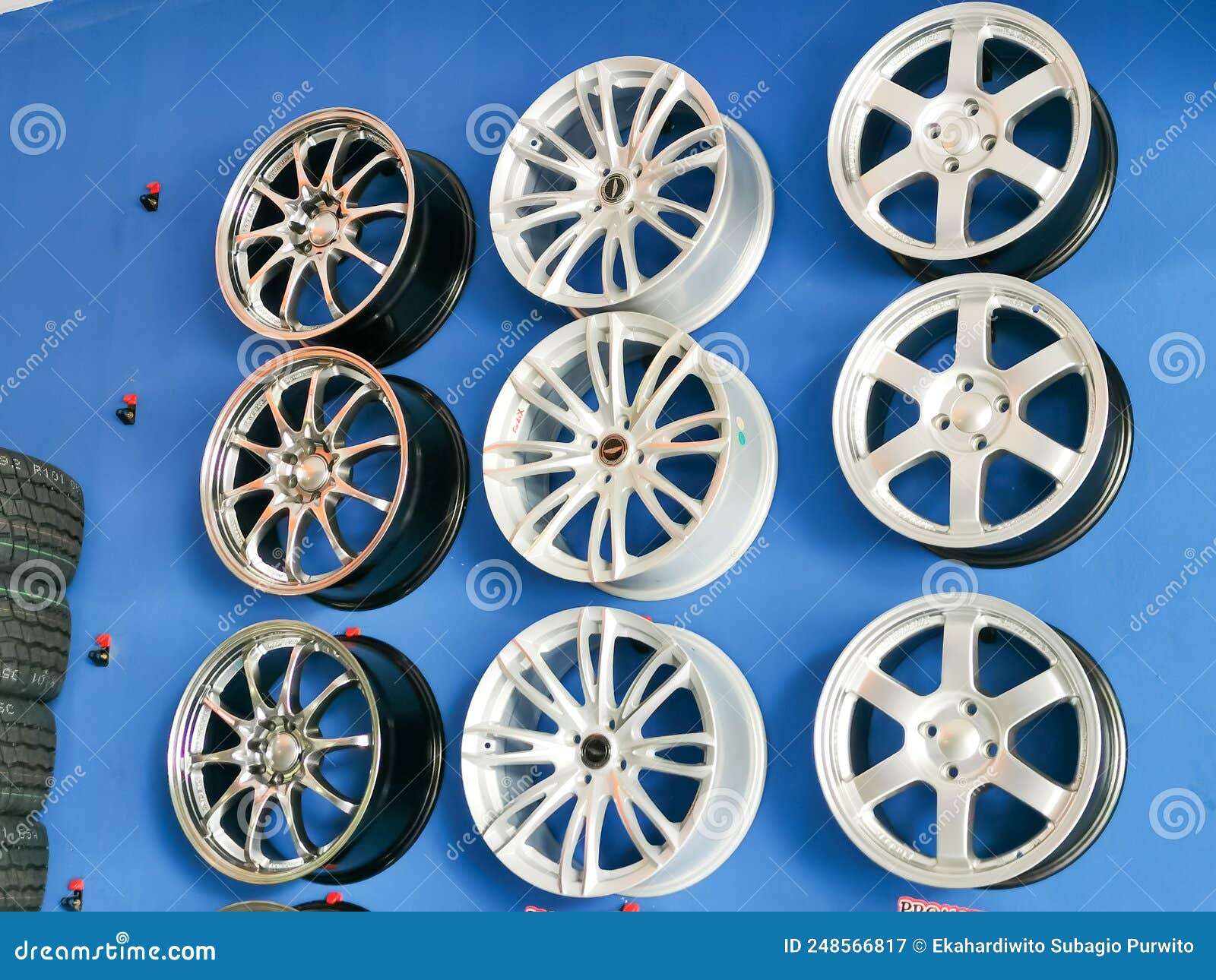Various Pattern New Car Rims Hanging on the Concrete Wall. Stock Image ...
