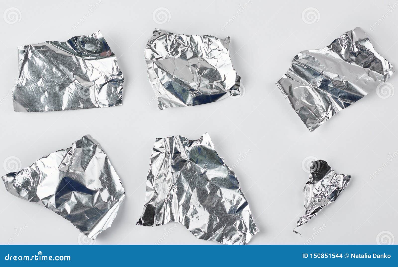 Various Pieces of Silver Foil on a White Background Stock Photo - Image ...