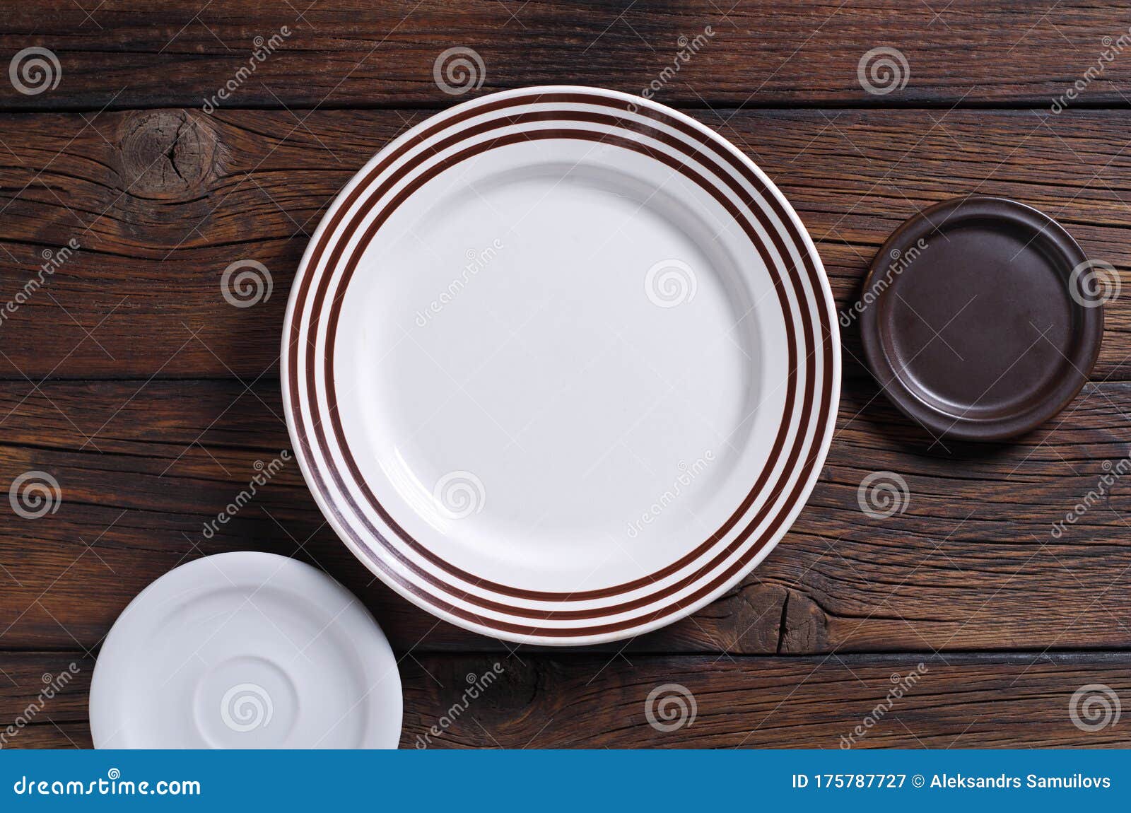 Various plates on table stock image. Image of ceramic - 175787727