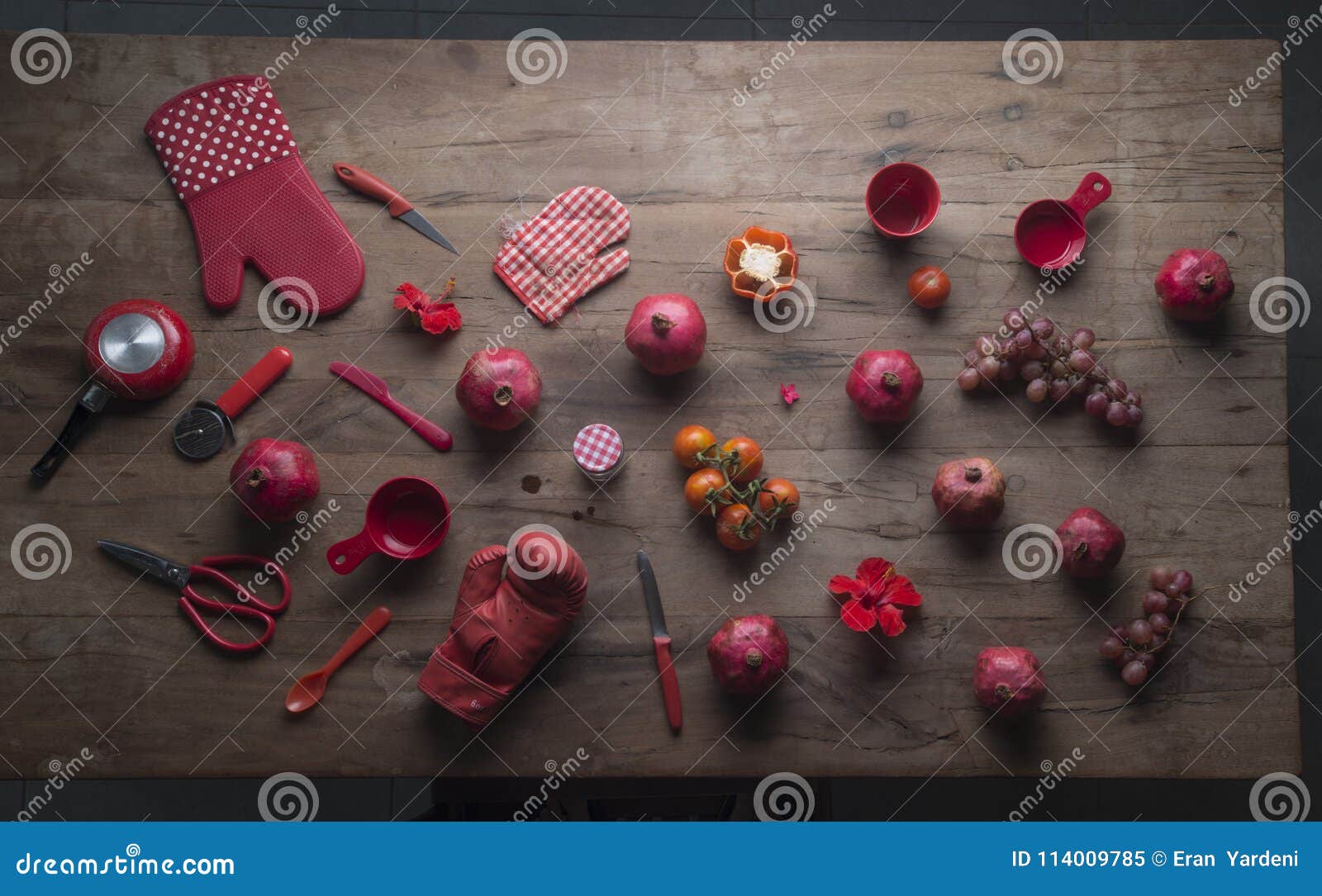 Various Red Objects on a Wooden Table Stock Image - Image of grapes ...