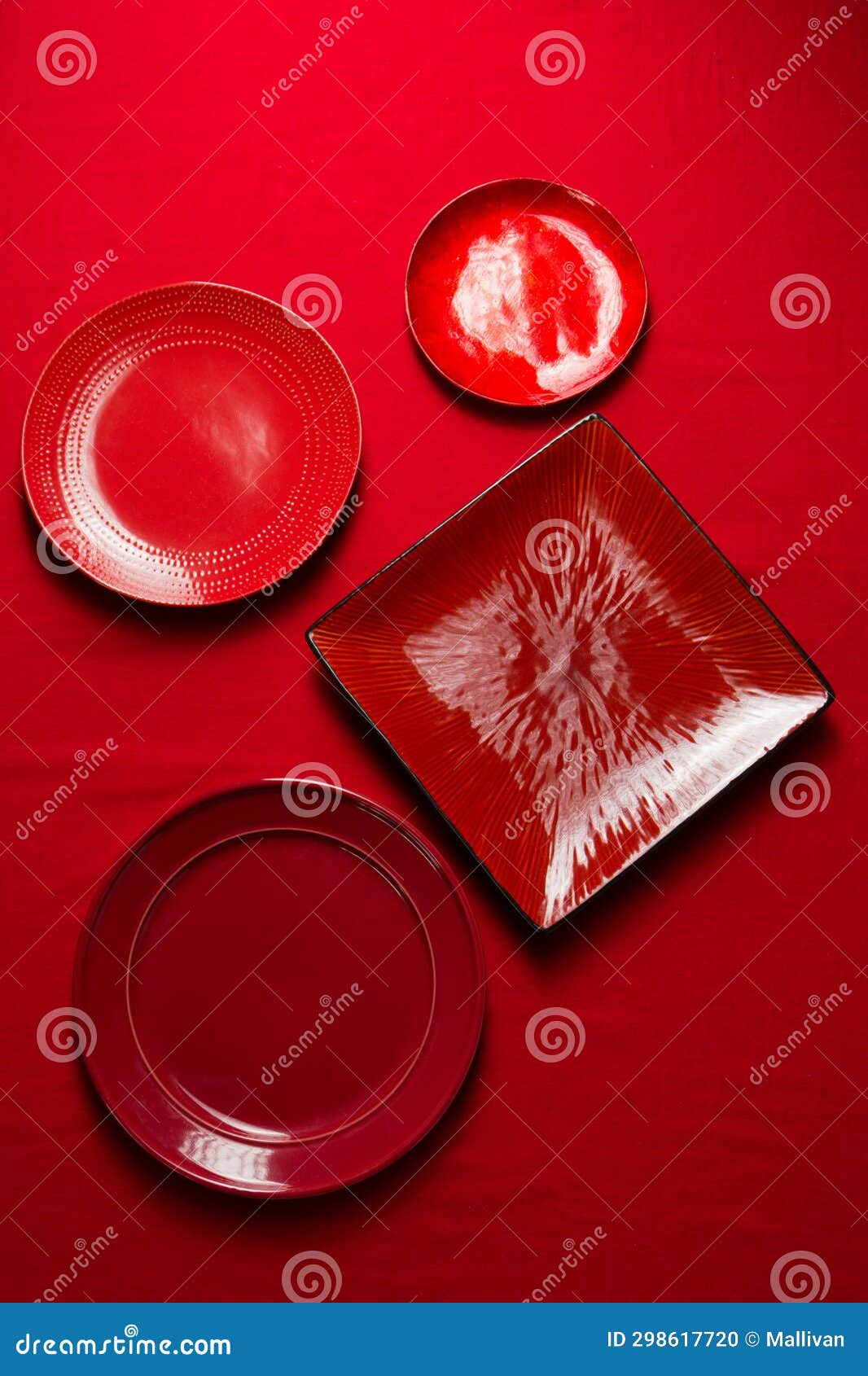 Various Red Plates on a Red Tablecloth on the Table Stock Photo - Image ...
