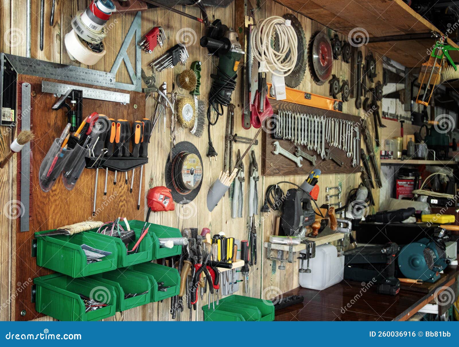 Various Tools Hang on a Wooden Wall in a Workshop Stock Photo - Image ...