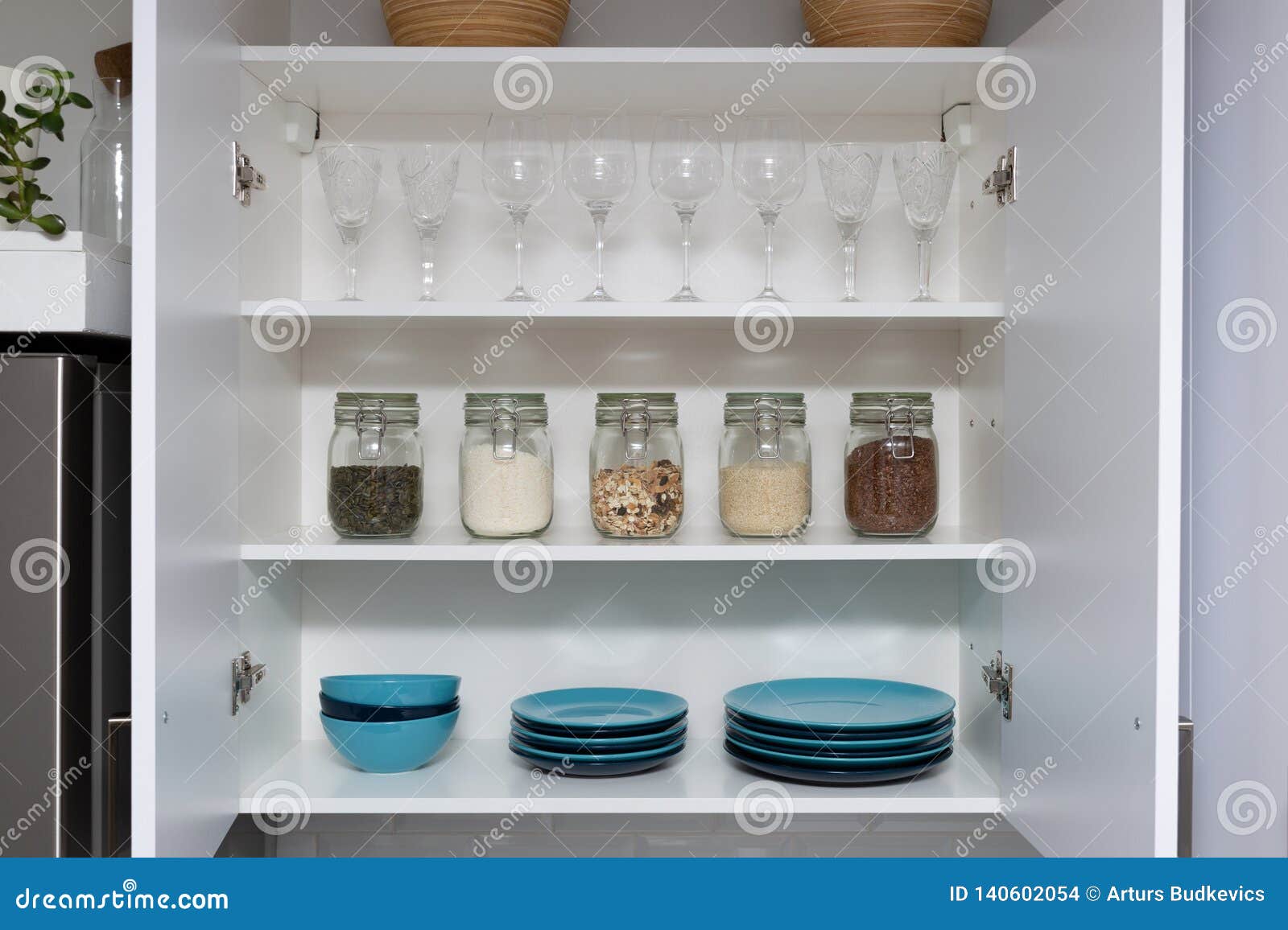 Various Seeds In Storage Jars In Pantry, White Modern Kitchen In ...