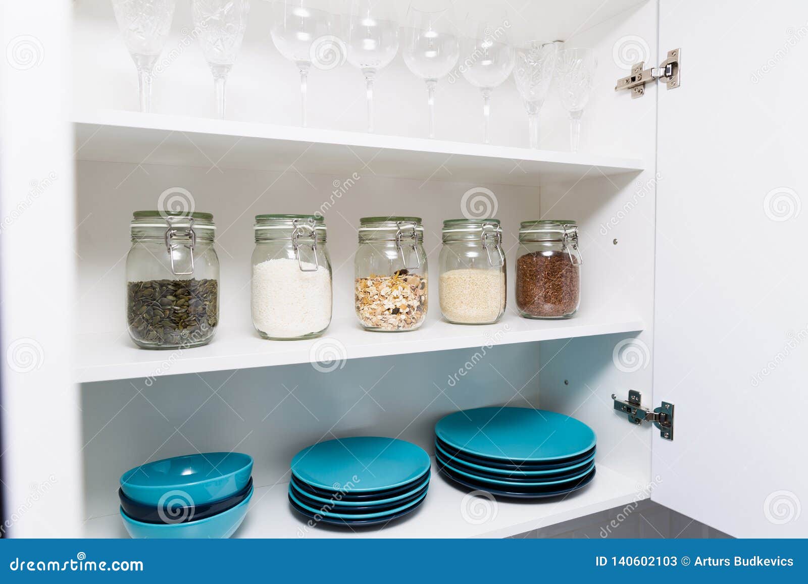 Various Seeds in Storage Jars in Pantry, White Modern Kitchen in ...