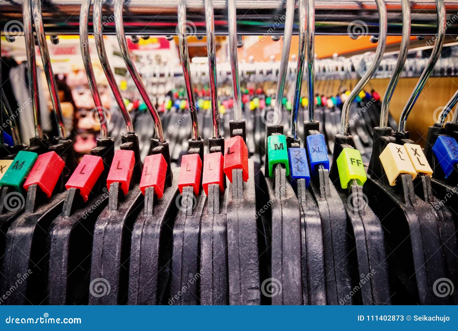 Various Size Tags for Clothes on a Rack. Editorial Stock Photo - Image ...