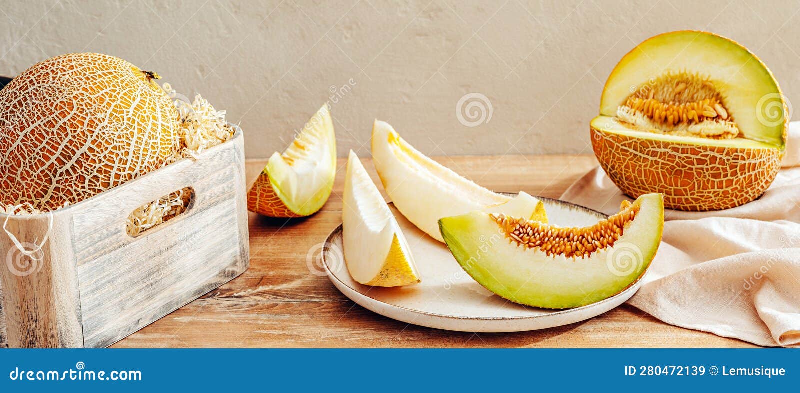 Various Sliced Melons on Wooden Table by Stone Wall Stock Image - Image ...