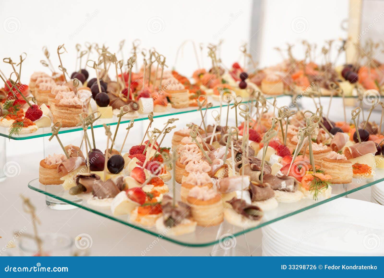 Various Snacks in Plate on Banquet Table Stock Photo - Image of dish ...