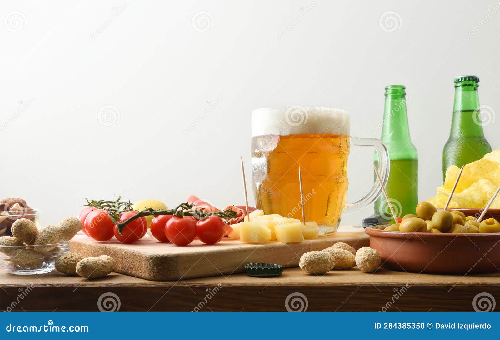 Various Snacks on Wooden Table with Beer Mug Isolated White Stock Photo ...