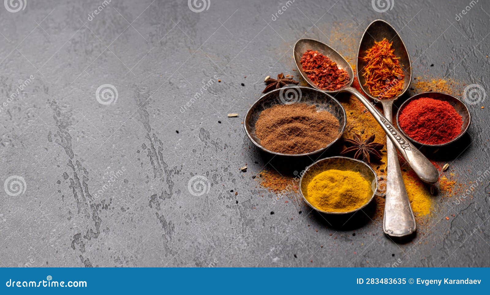 Various Spices in Bowls and Spoons on Stone Table Stock Image - Image ...