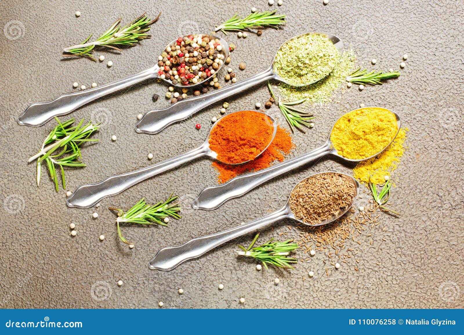 Various Spices in a Spoon on Grey Background Stock Photo - Image of ...
