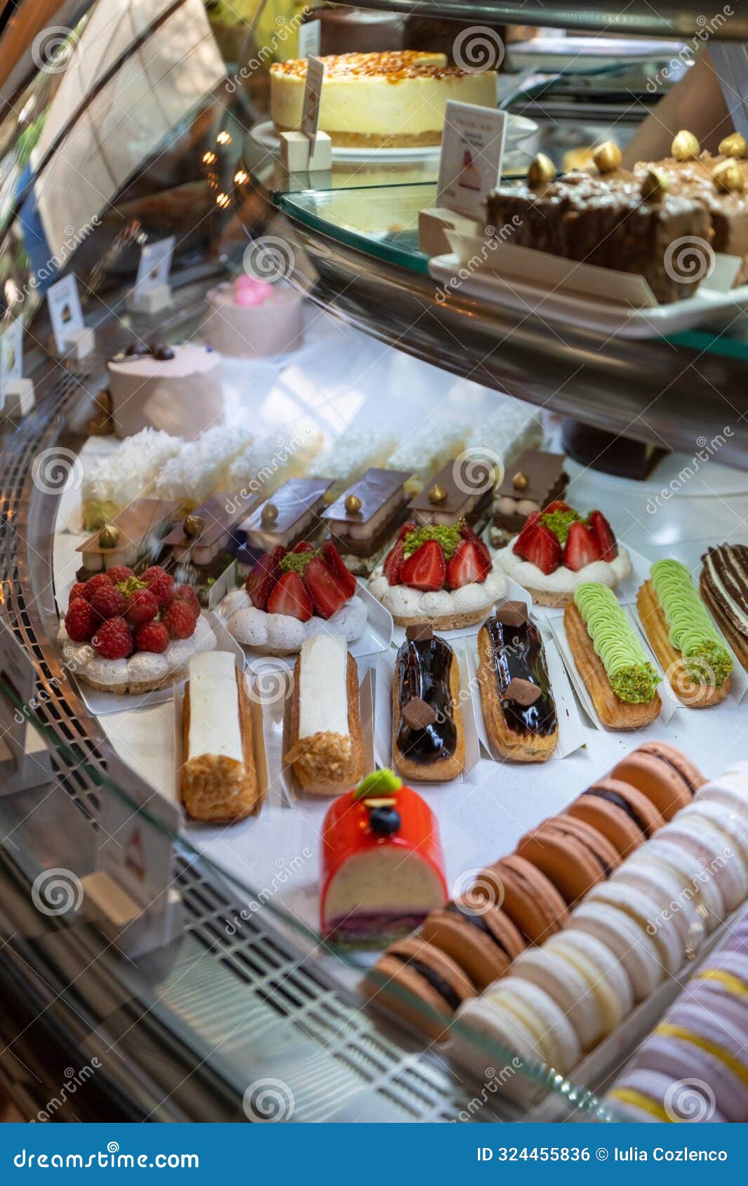Various Sweets and Pastries Displayed on Shelves in a Bakery Stock ...