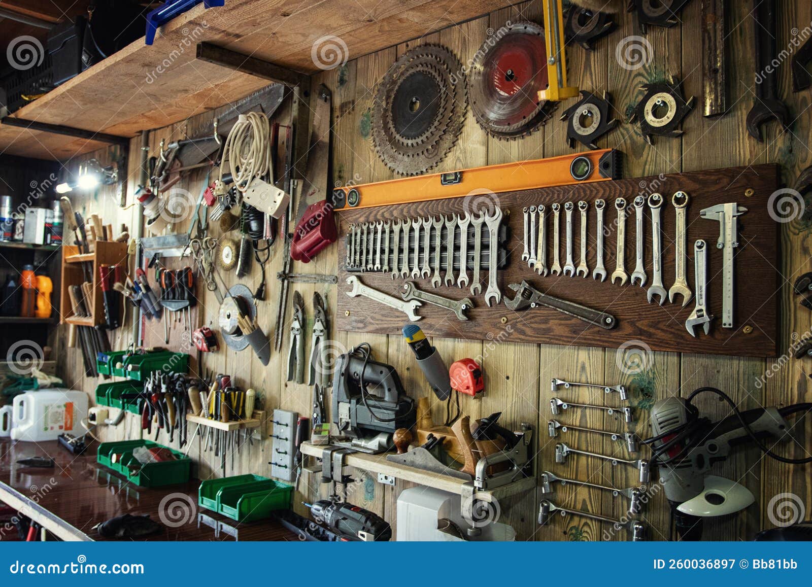 Various Tools Hang on a Wooden Wall in a Workshop Stock Image - Image ...