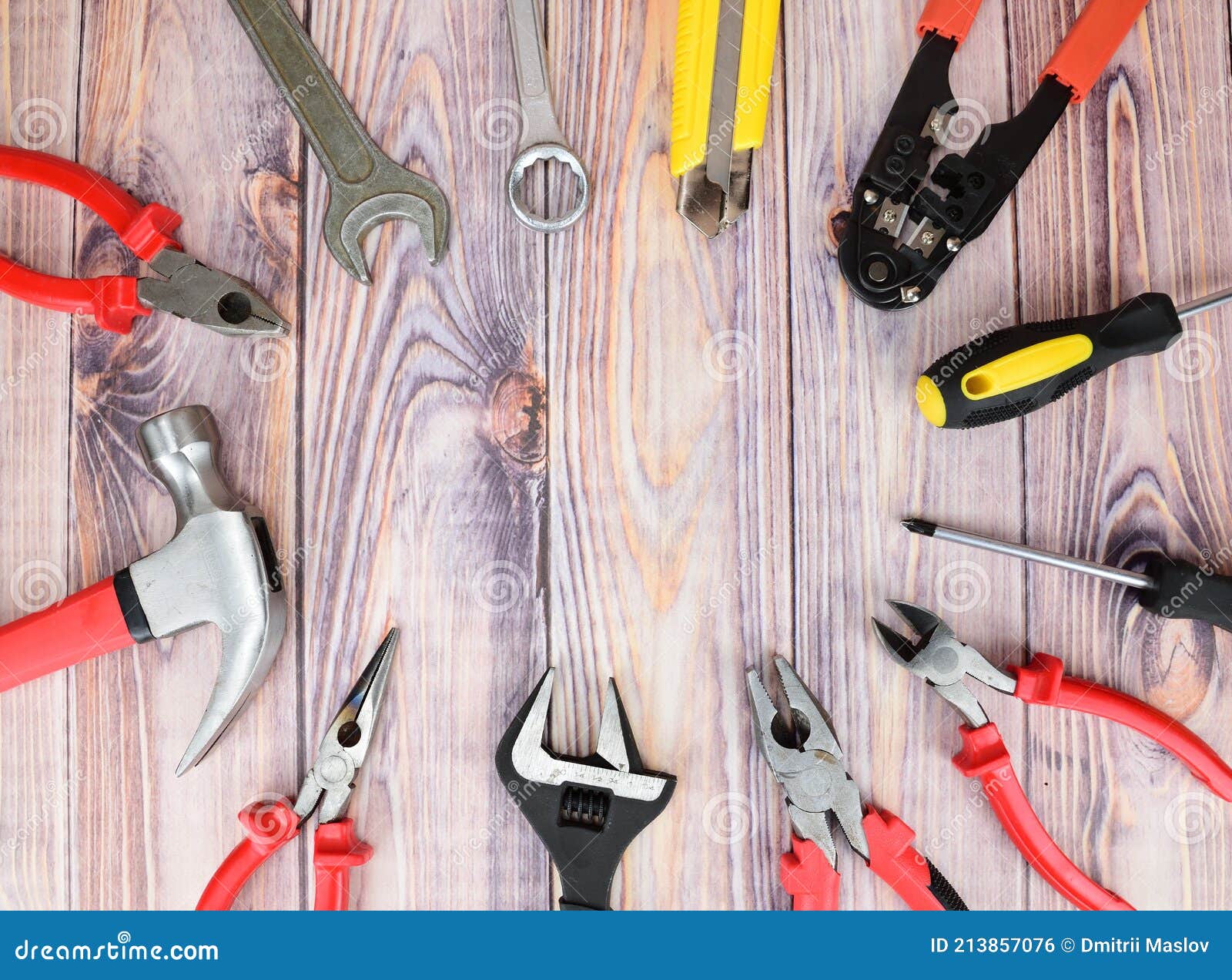 Various Tools Laid Out in a Circle on a Wooden Floor Stock Photo ...