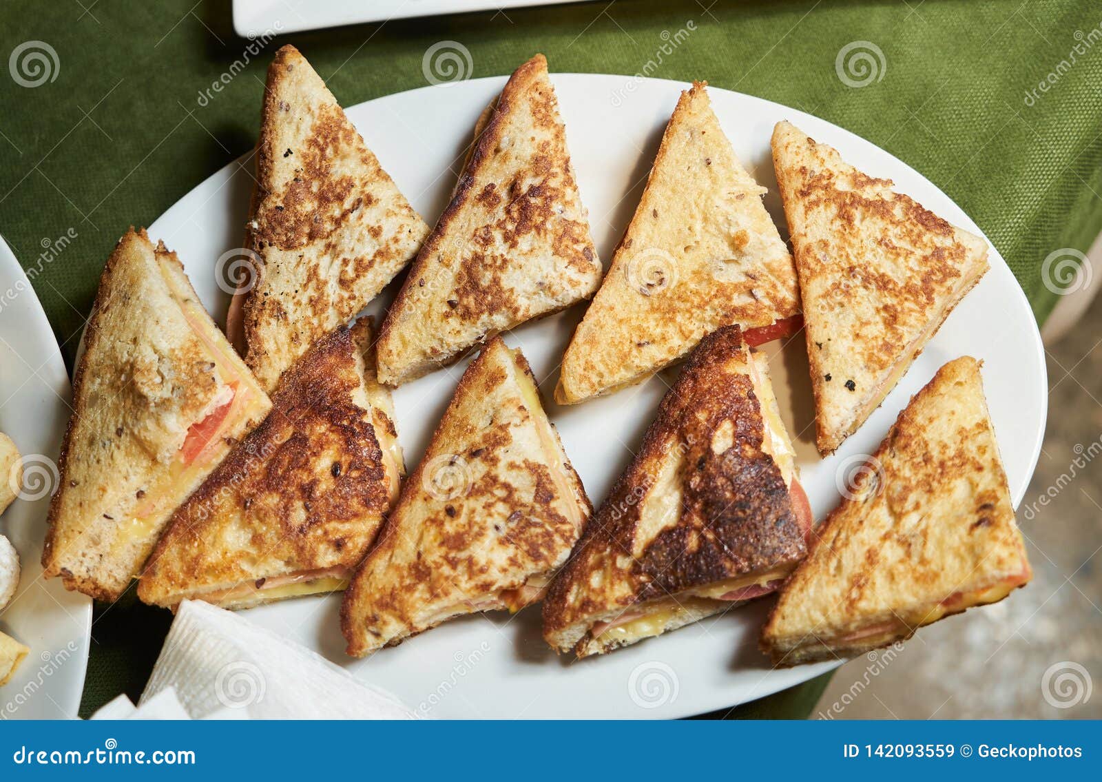 Various Triangle Toasts Sandwiches on a White Plate, Close-up Stock ...