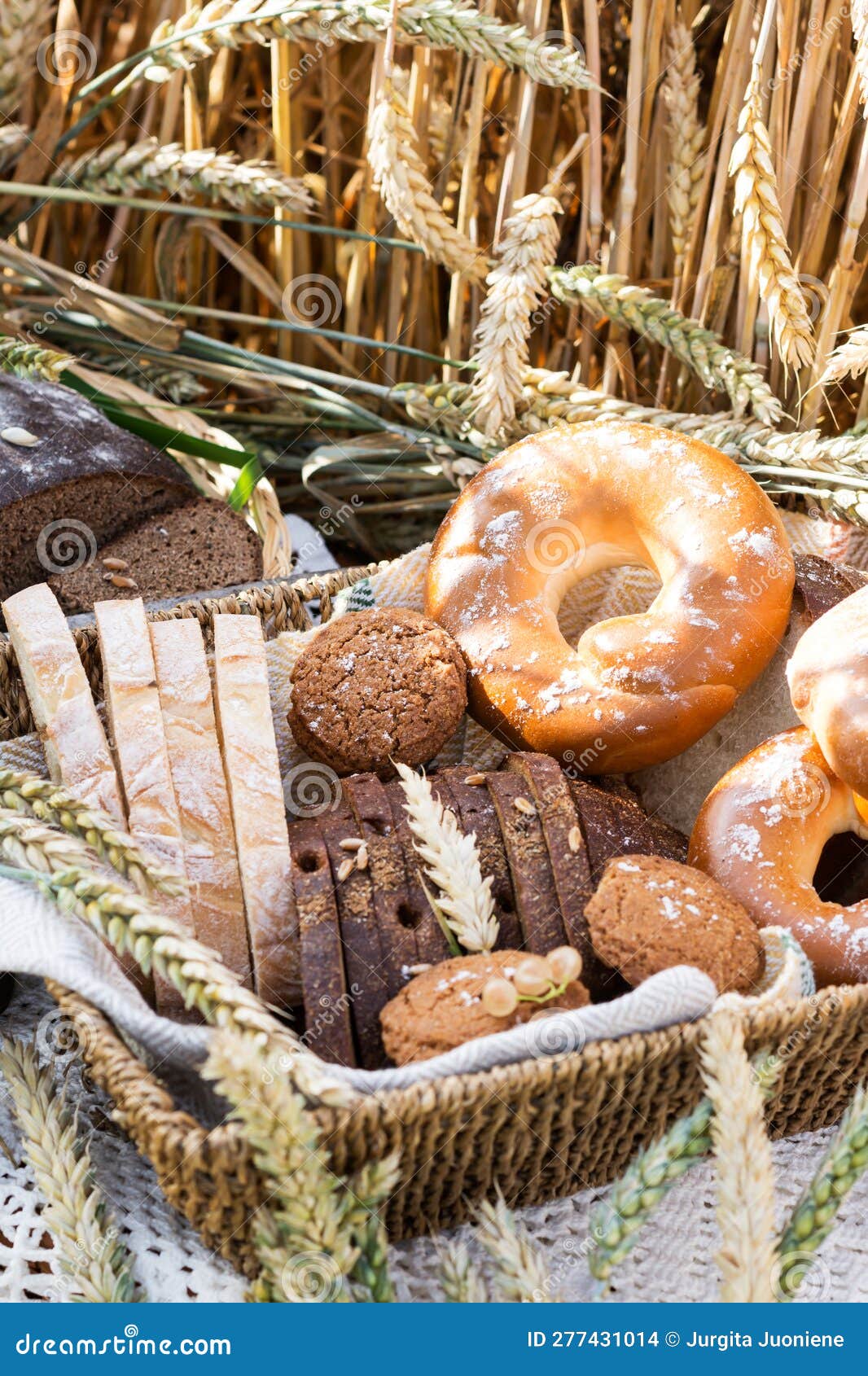 Various Types of Bread and Other Pastries in Wicker Tray on Lace ...