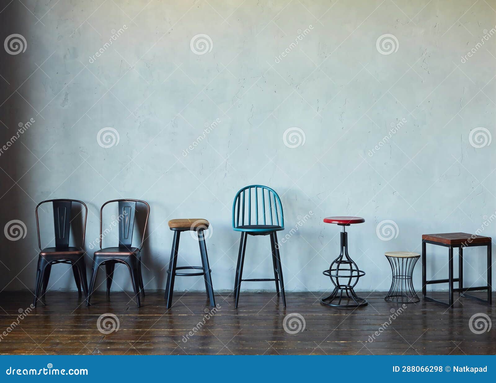 Various Types of Chairs and Stools Stand Against the Gray Wall. Stock ...