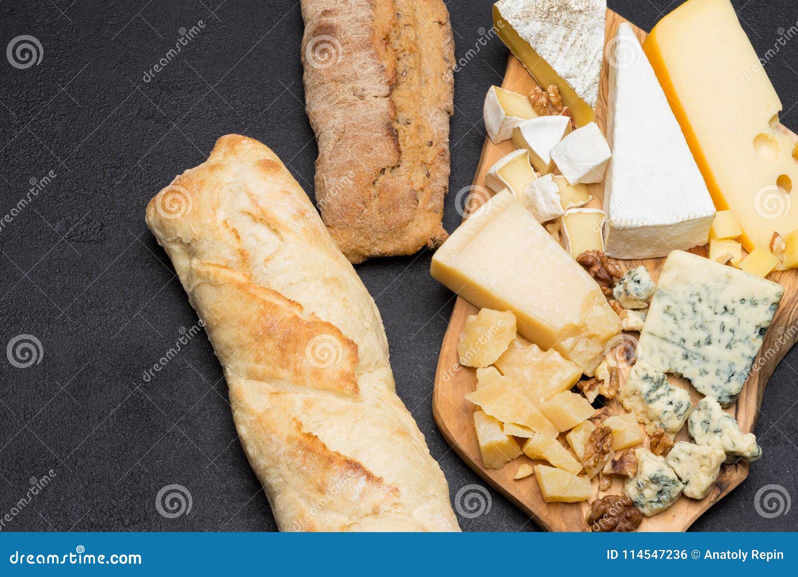 Various Types of Cheese and Bread on Wooden Board Stock Photo - Image ...